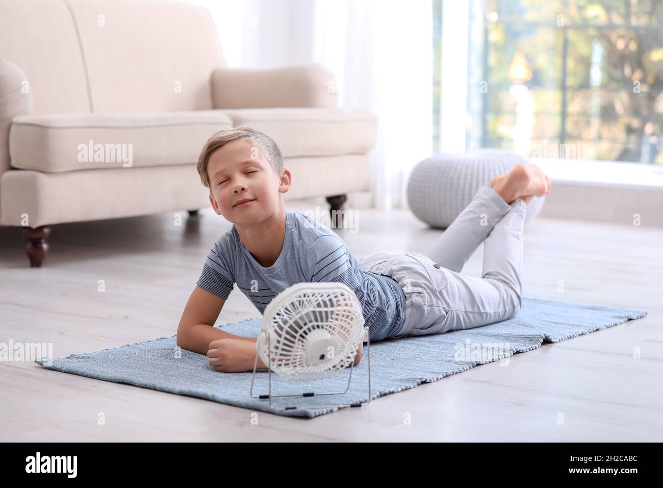 Fan blowing boy hi-res stock photography and images - Alamy