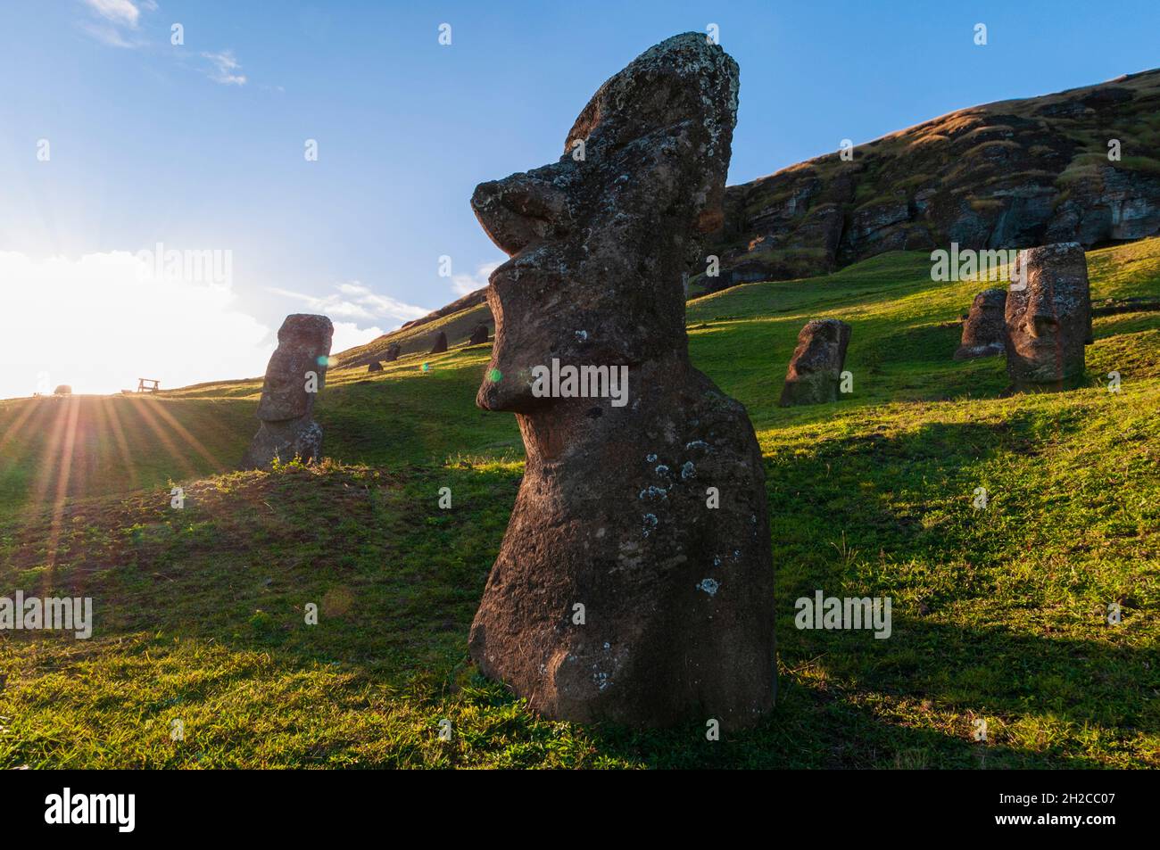 Light cast long shadows of Moai statues in Rano Raraku. Rapa Nui ...