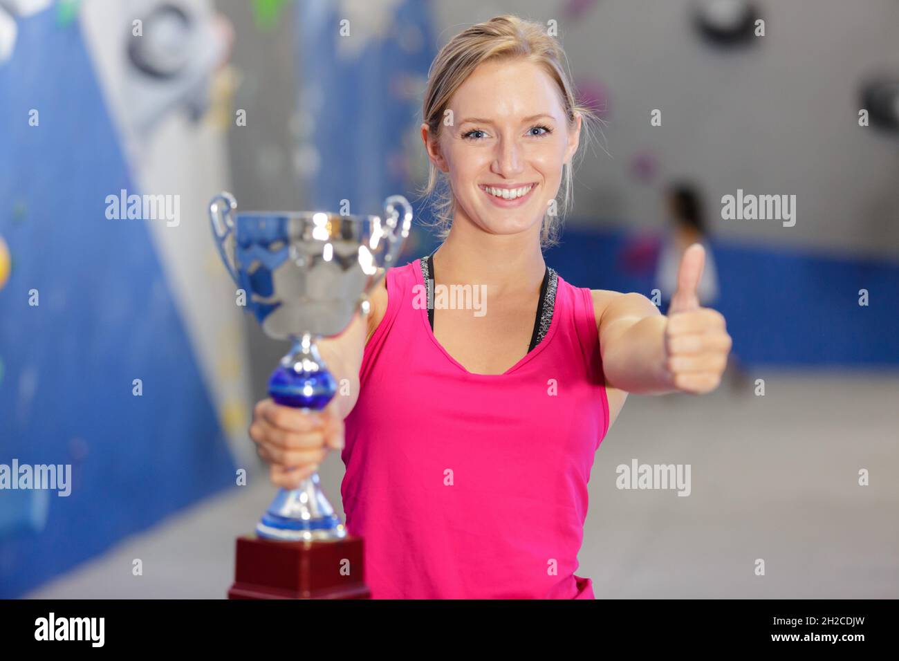Happy female athlete holding trophy hi-res stock photography and images ...