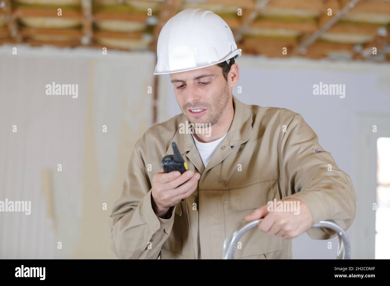 civil engineer wearing safety helmet using radio walkie talkie Stock ...