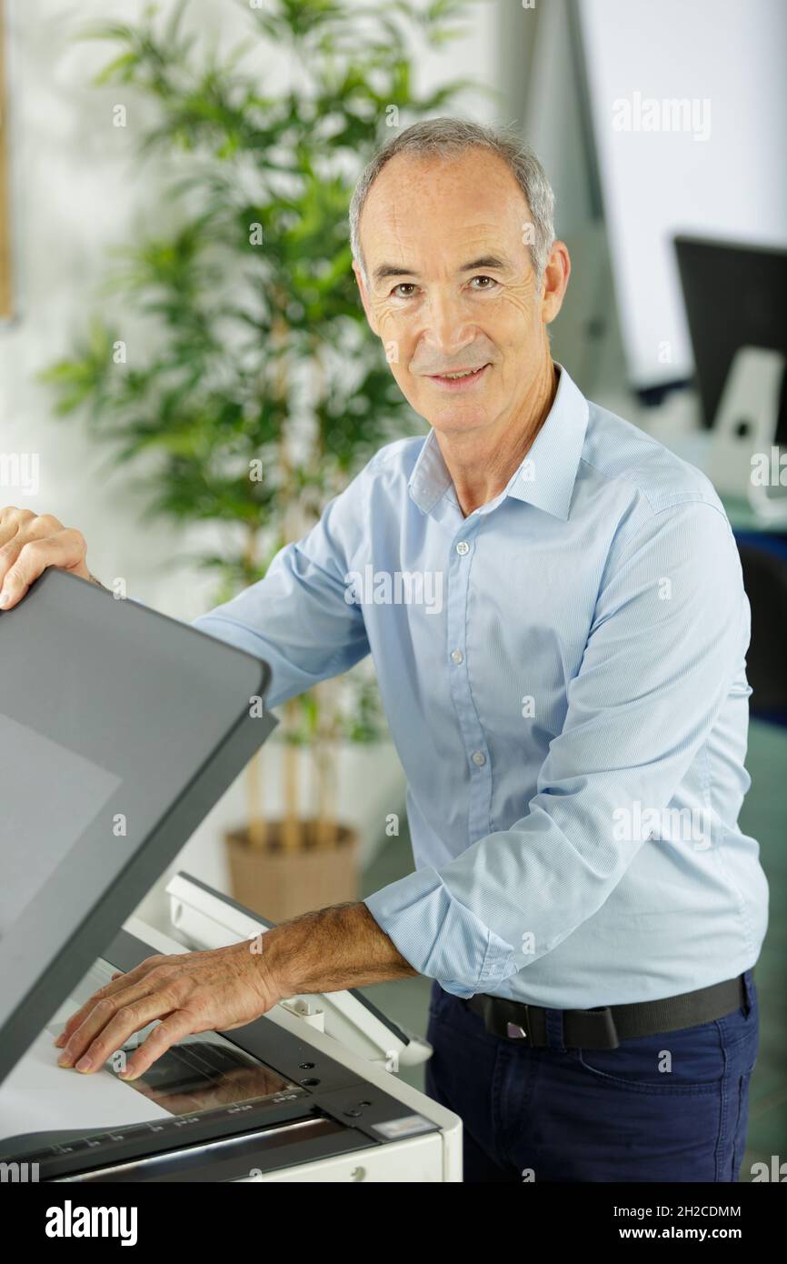 People using photocopier hi-res stock photography and images - Alamy