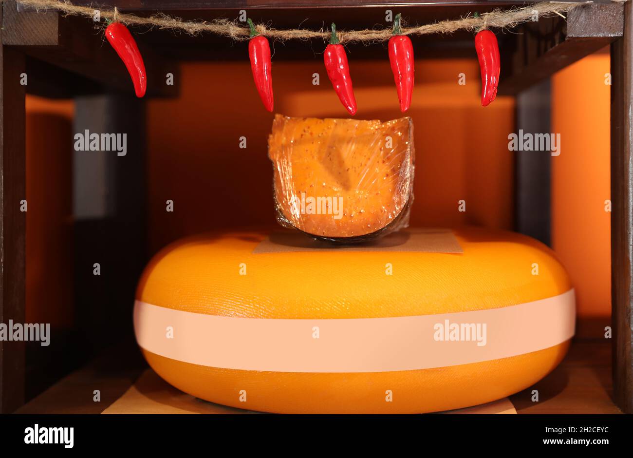 Delicious cheese on rack shelf in store. Dairy product Stock Photo - Alamy