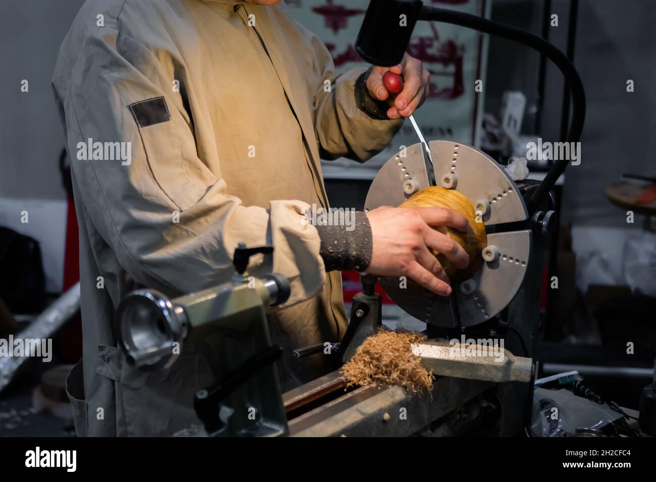 Professional man carpenter preparing wood turning lathe to work Stock ...
