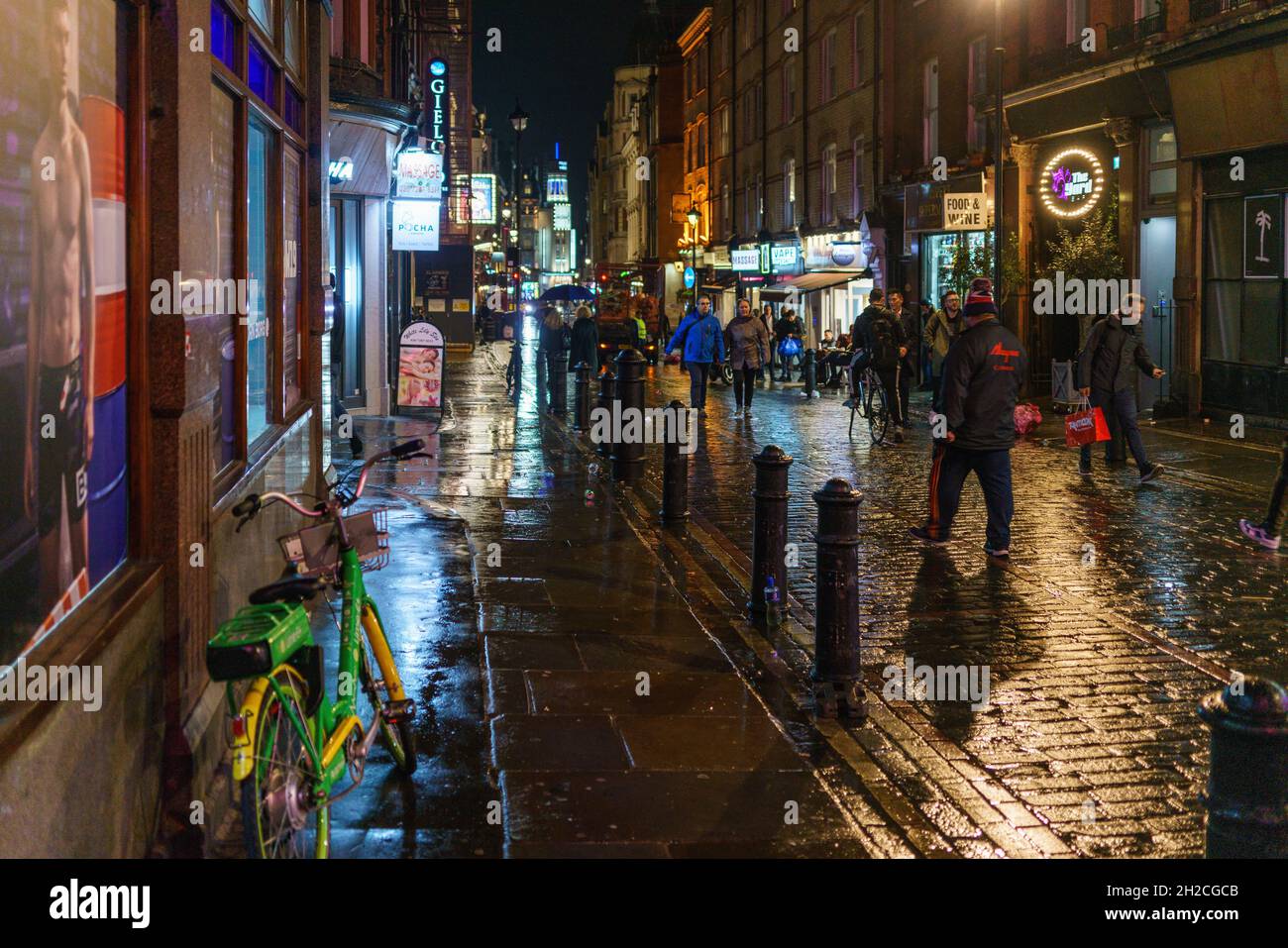 Street photography showing wet Soho streets in London at night Stock ...