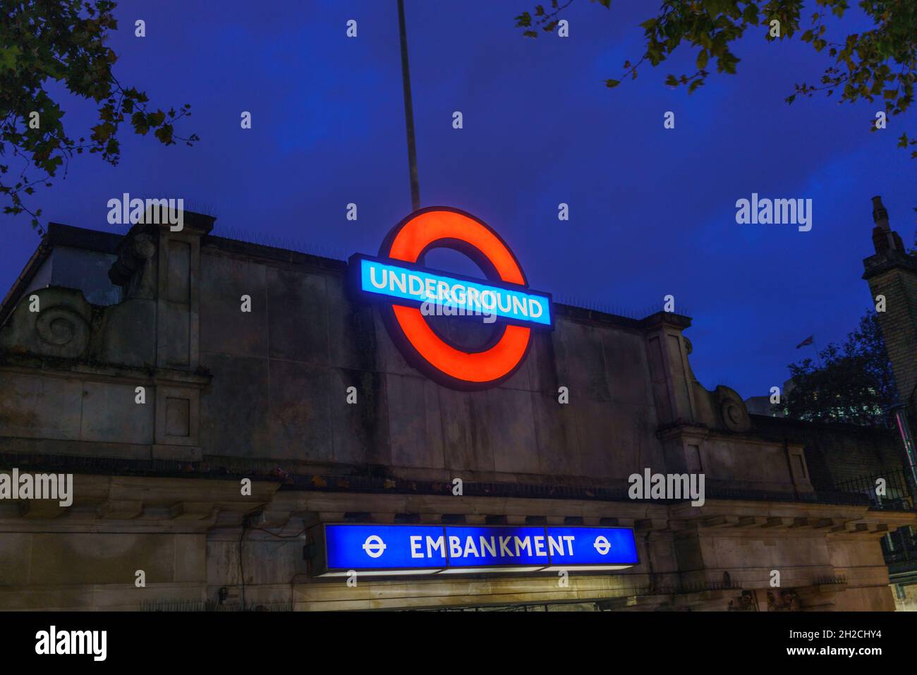 Neon light sign for Embankement underground station in London at night ...
