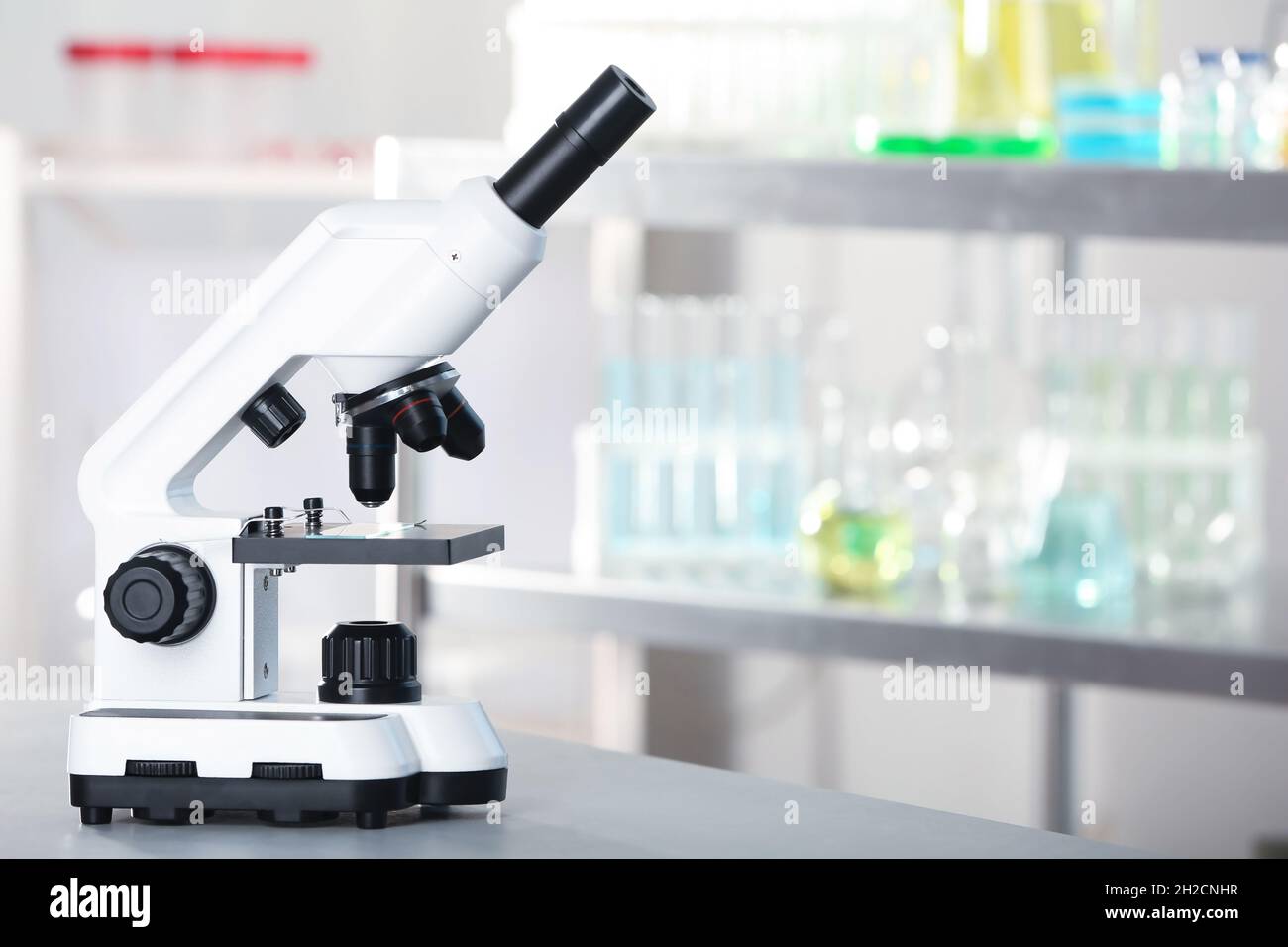 Modern microscope on table in laboratory. Chemical analysis Stock Photo ...
