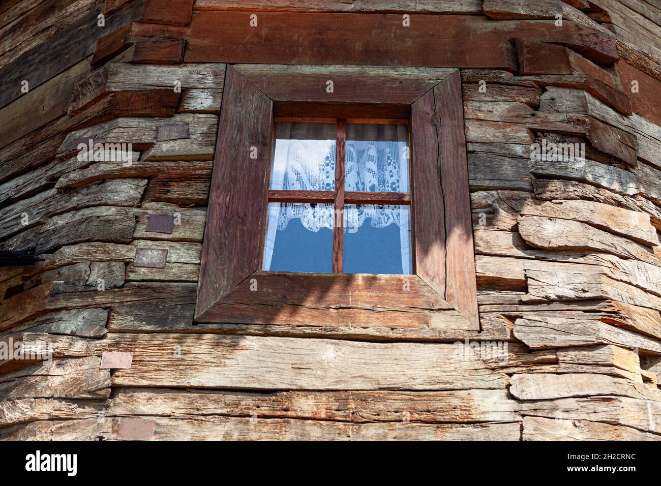 Rustic house made by wooden beams . Window and wooden wall Stock Photo ...