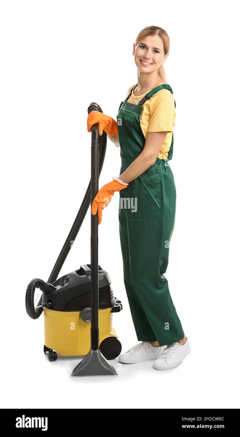 Female janitor with carpet cleaner on white background Stock Photo - Alamy