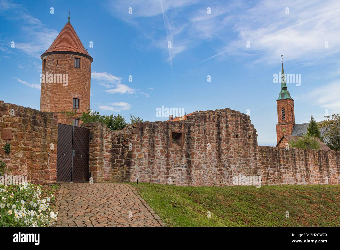 Small fortified village with tall buildings on top of a hill in ...