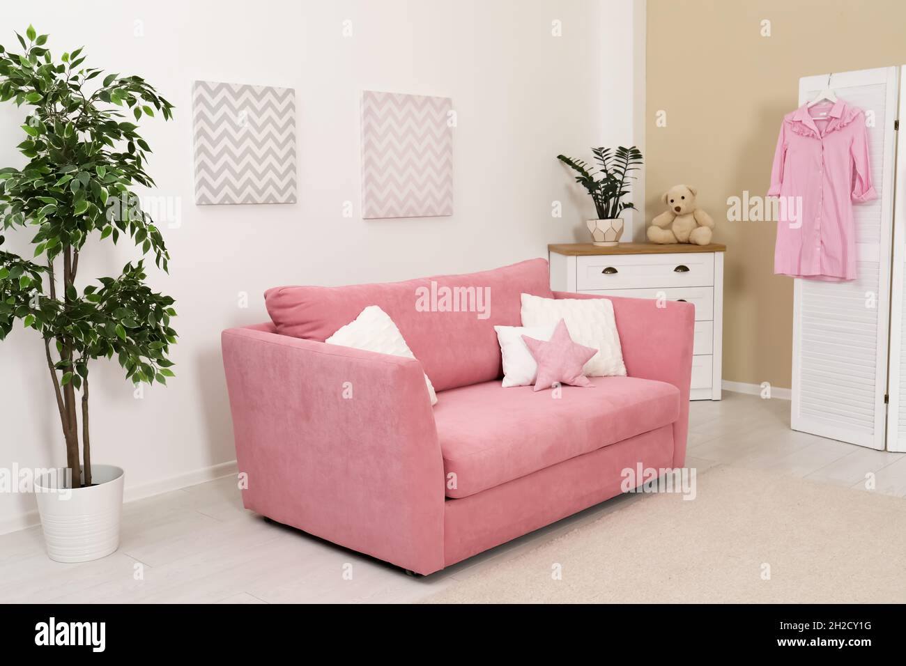Cozy child room interior with sofa and modern decor elements Stock ...