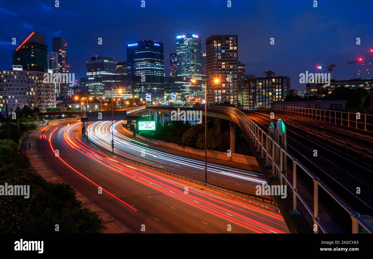 Traffic light trails on Aspen Way looking towards Canary Wharf, London ...