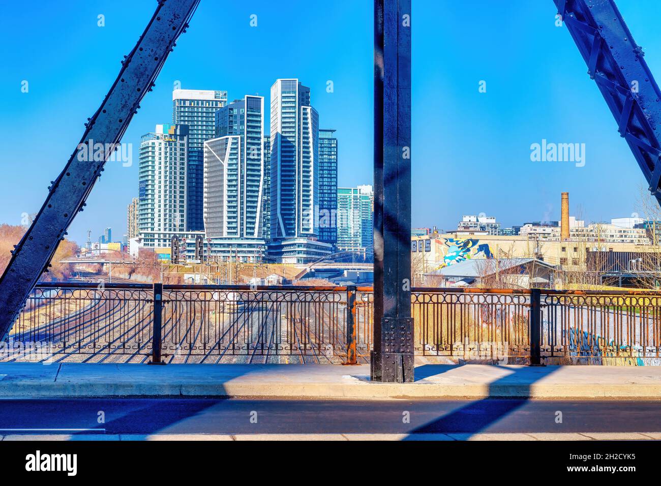 Toronto skyscrapers framed in the Sir Isaac Brock Bridge which is a ...