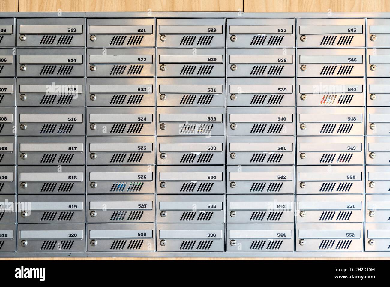 Modern metal mailboxes with lock and numbering in a residential ...