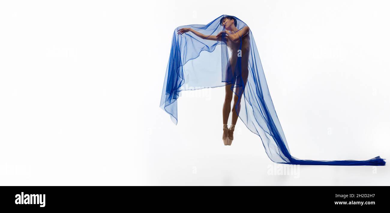 Portrait of young adorable Japanese ballerina dancing with transparent ...