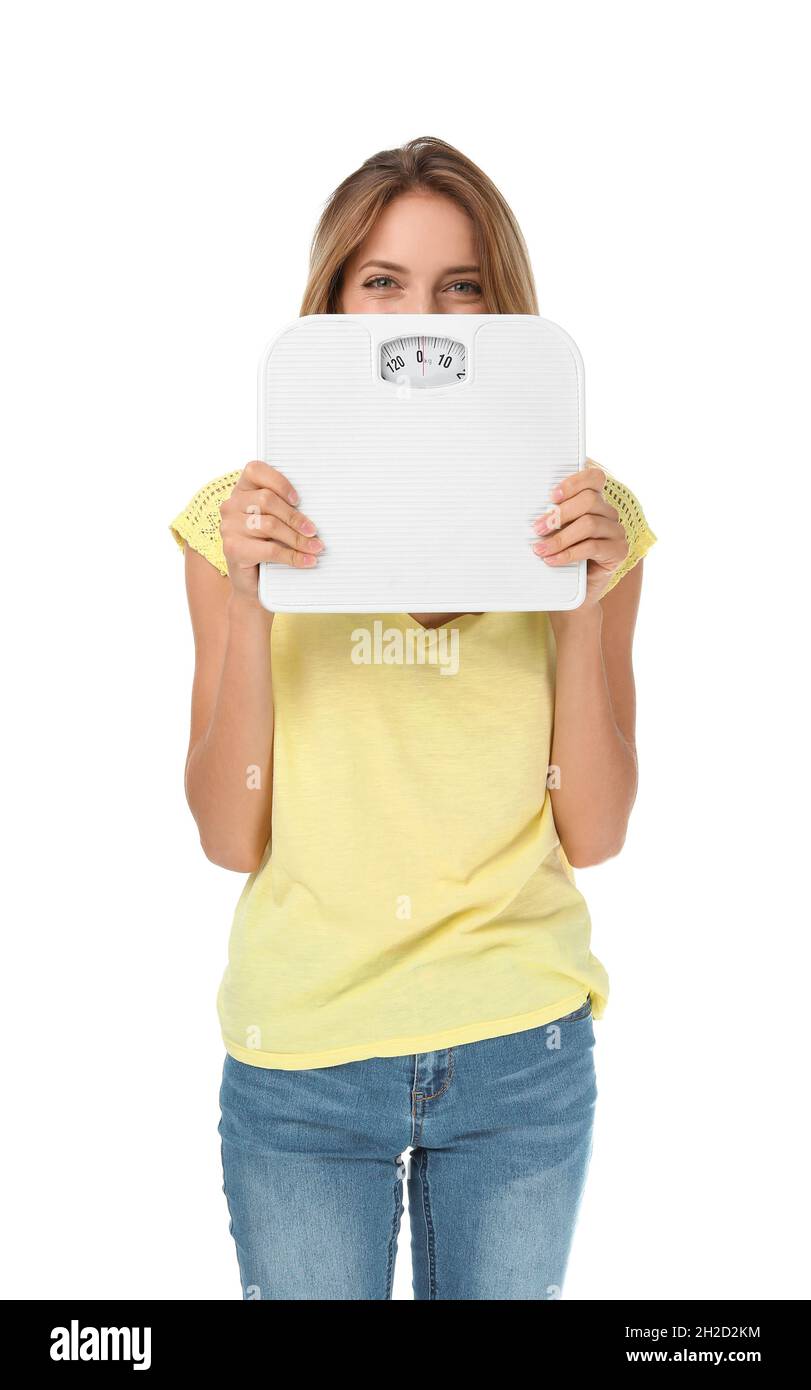 Happy slim woman satisfied with her diet results holding bathroom ...