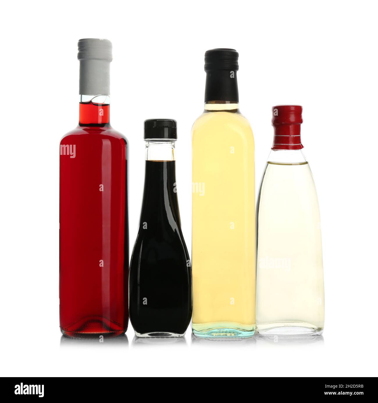 Bottles with different kinds of vinegar on white background Stock Photo ...