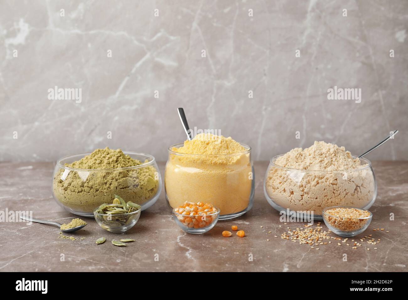 Composition with different types of flour on table Stock Photo - Alamy