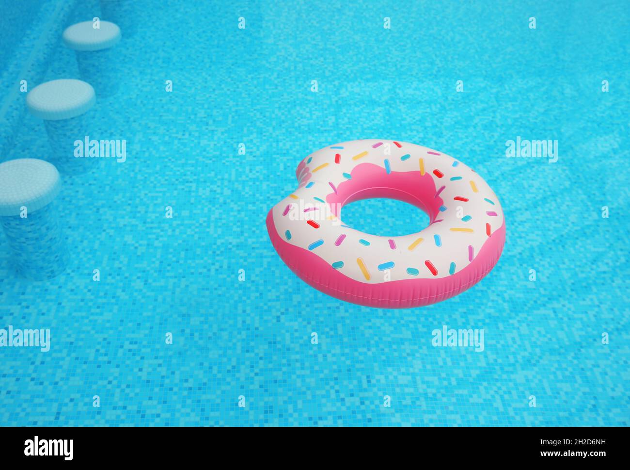 Inflatable ring floating on water in swimming pool Stock Photo - Alamy