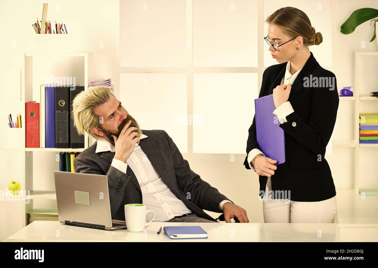 male boss with his secretary. office couple discuss business. modern ...