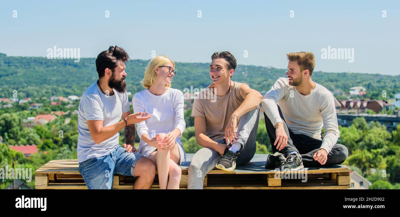 Discussing ideas. Summer vacation. Cheerful friends relaxing. Men and ...