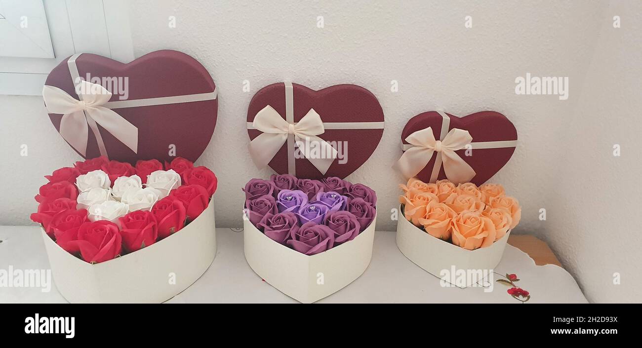 Heart-shaped boxes with colorful roses Stock Photo - Alamy