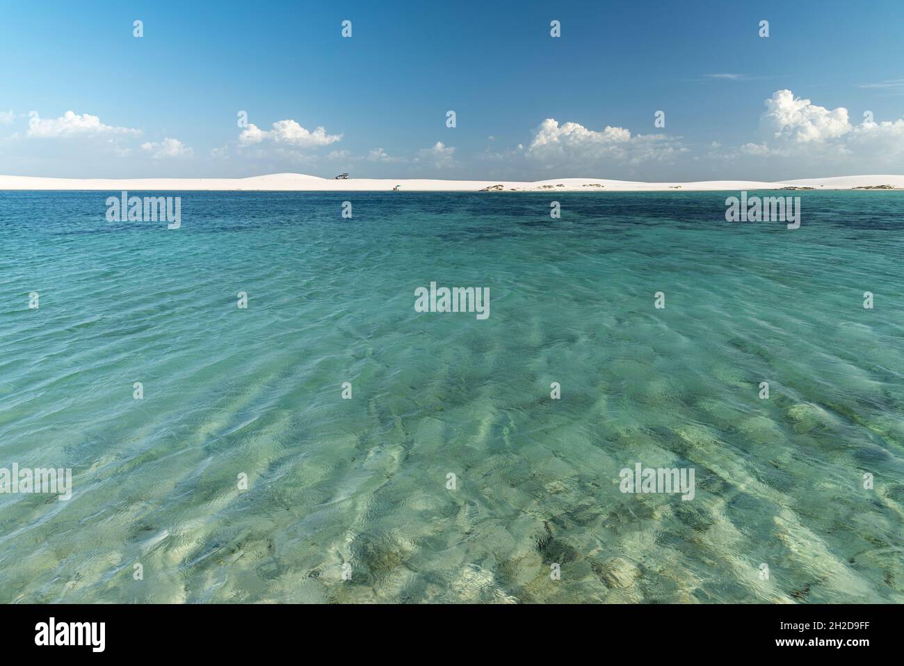 Beautiful view to blue rainwater lagoon on white sand dunes in Lençois ...