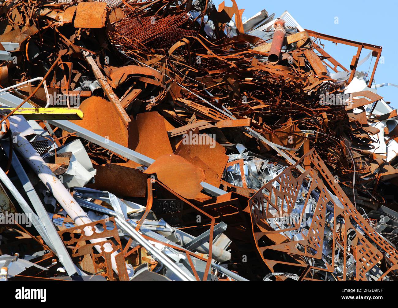 pile of rusty pieces of iron in the recycling shop for the recovery of ...