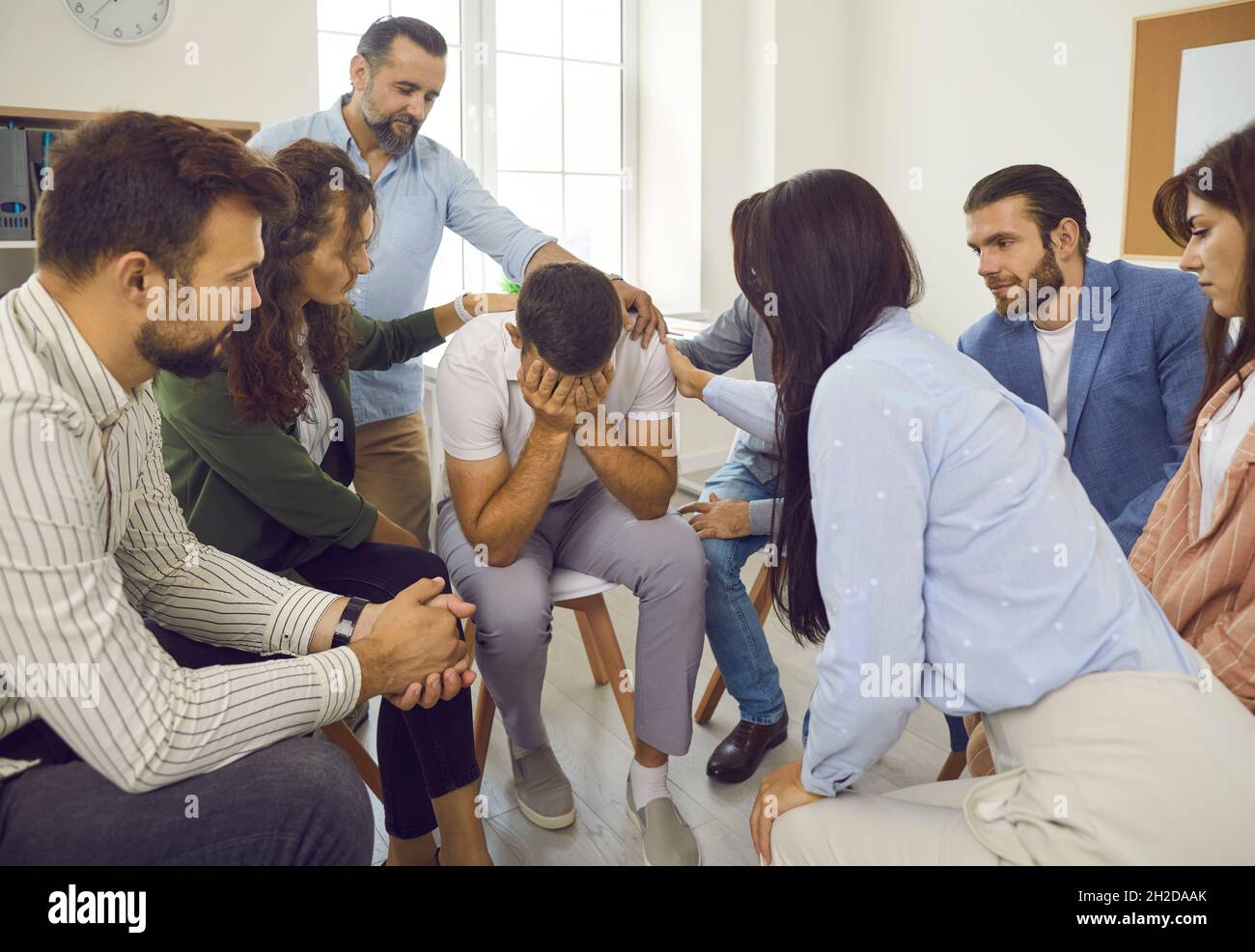 Young businessman in trouble shared his problem with colleagues who ...