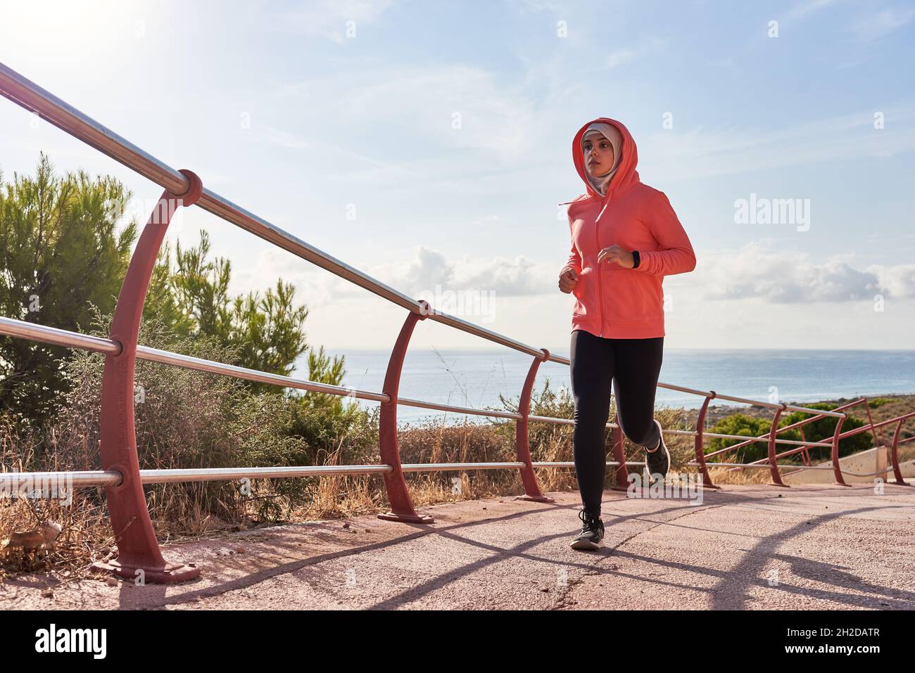 Muslim woman running outside hi-res stock photography and images - Alamy