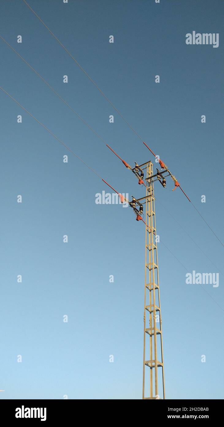 Low angle shot of an electrical tower during the day Stock Photo - Alamy