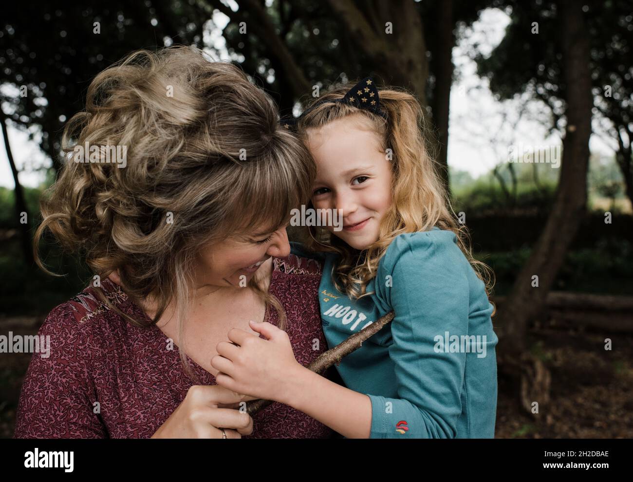 mother and daughter playfully laughing and hugging Stock Photo - Alamy