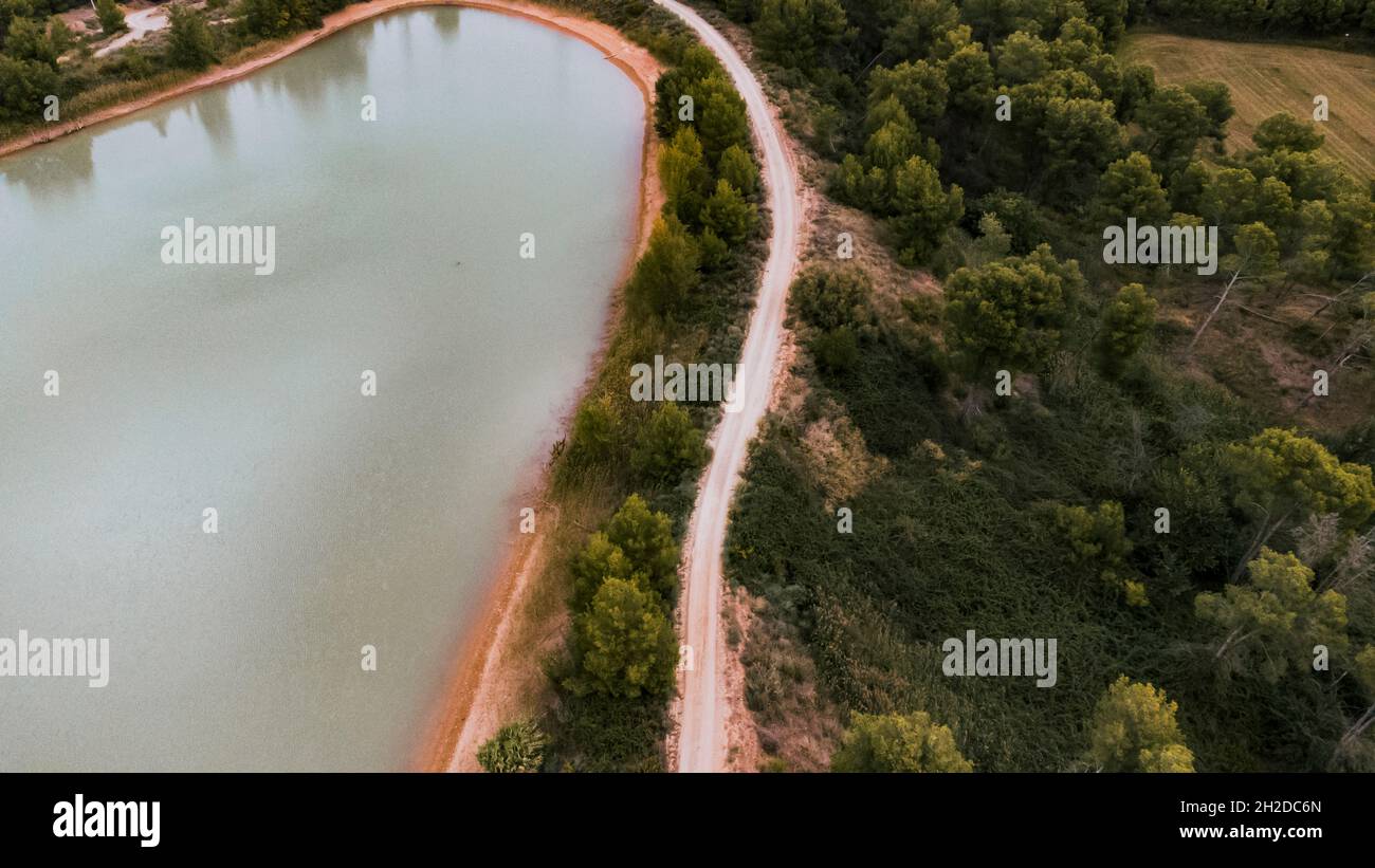 Aerial view of a lake next to a road Stock Photo - Alamy