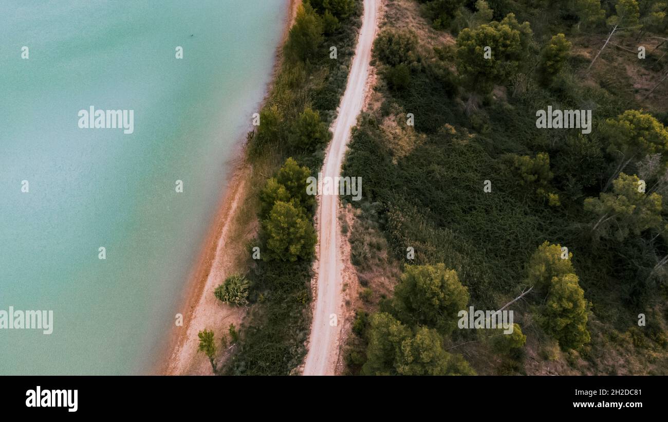 Aerial view of a lake next to a road Stock Photo - Alamy