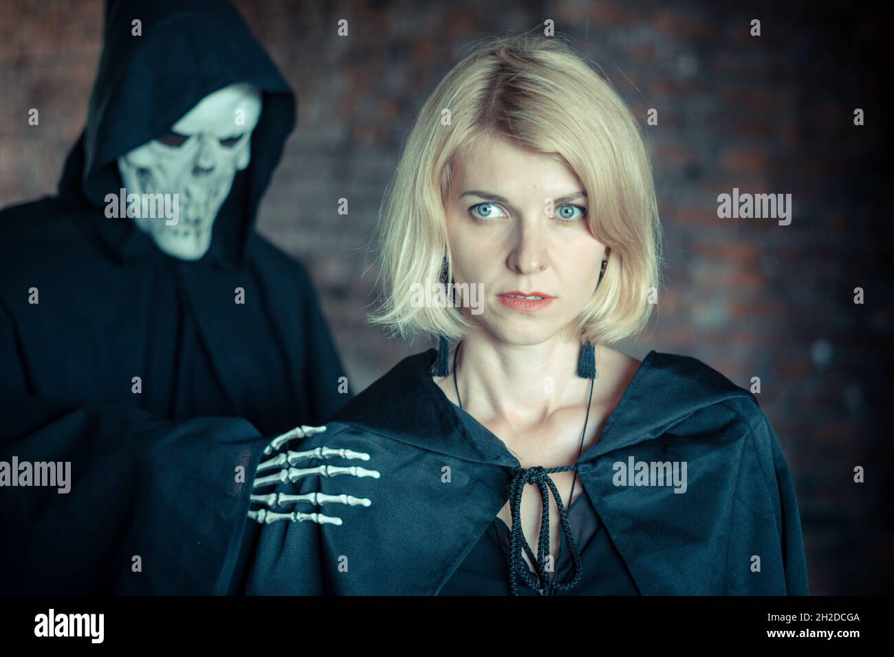 the girl and death in the cloak Stock Photo - Alamy