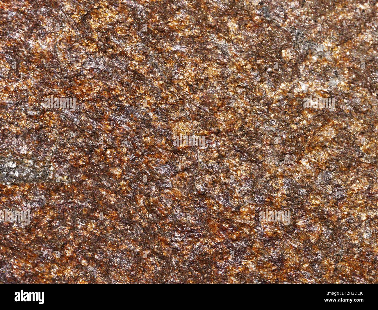 brown stone texture of the granite bed for a natural background close ...