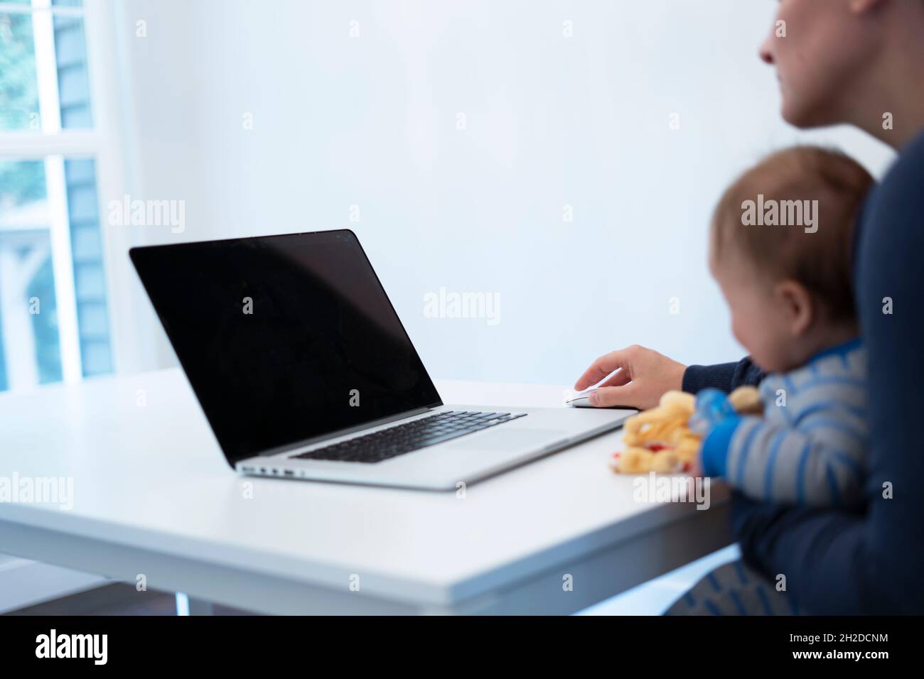 Holding infant son on lap hi-res stock photography and images - Alamy