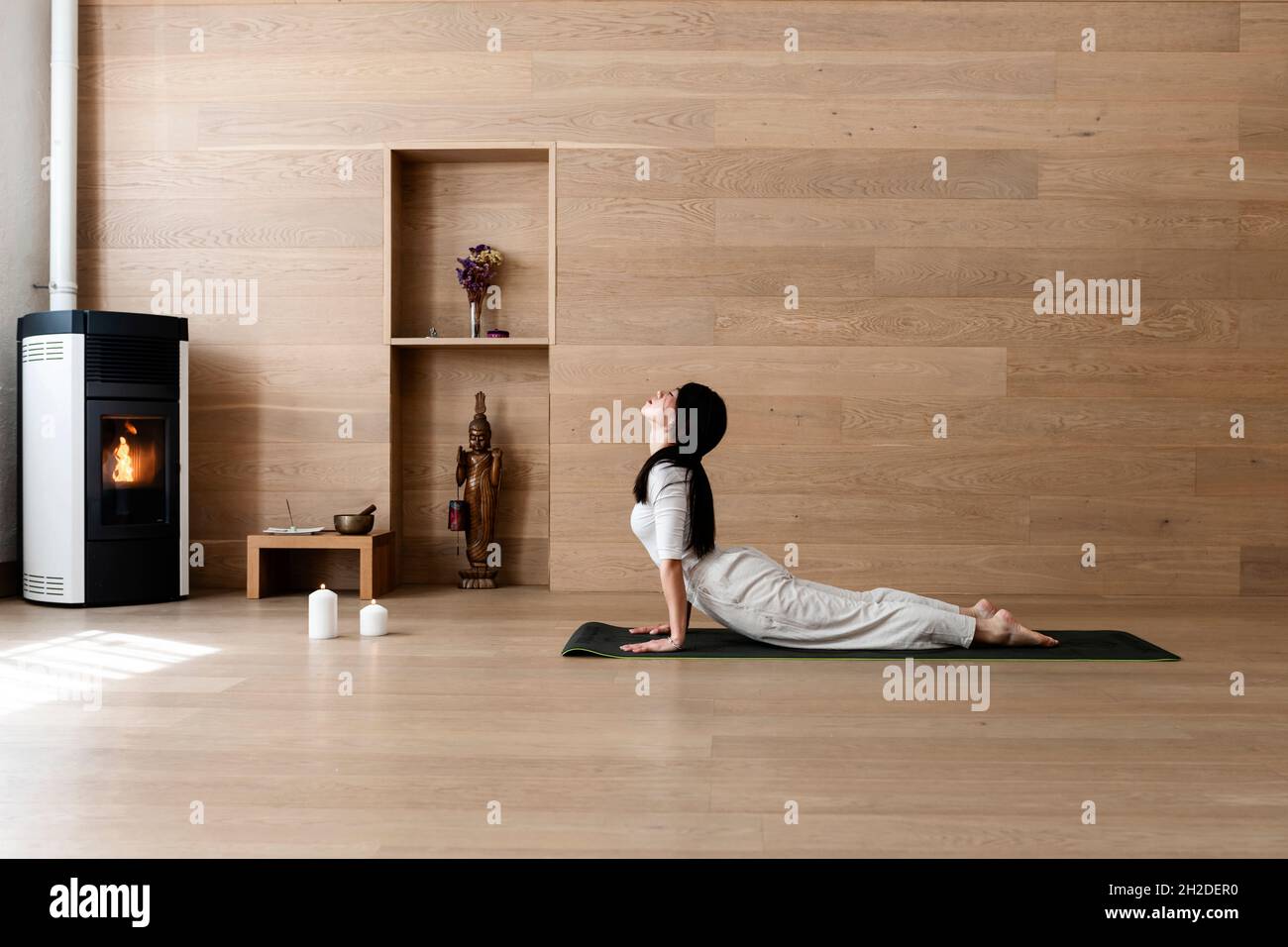 Sporty fit yogini woman practices yoga asana bhujangasana Stock Photo ...