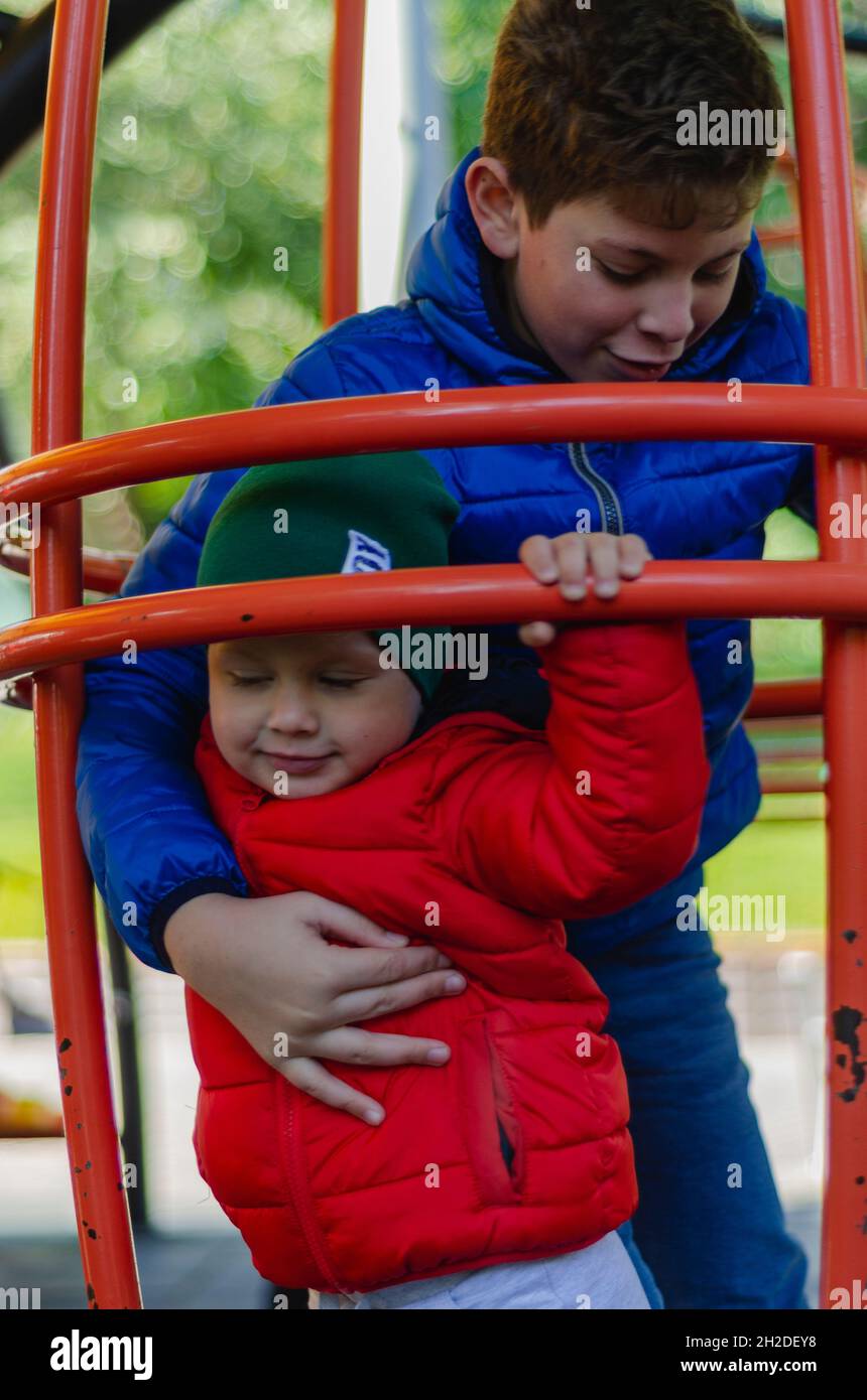 brothers play in the playground, free space Stock Photo - Alamy