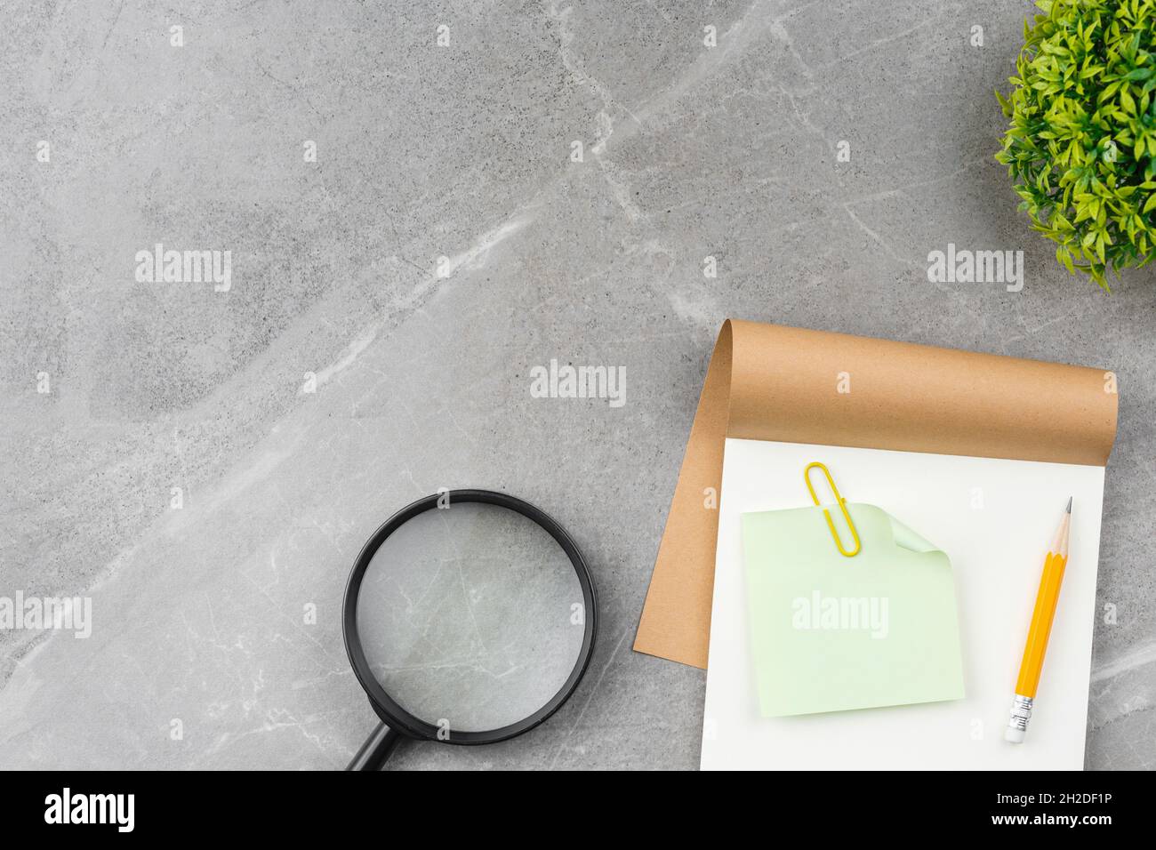 Open notepad office desk on gray marble background Stock Photo - Alamy