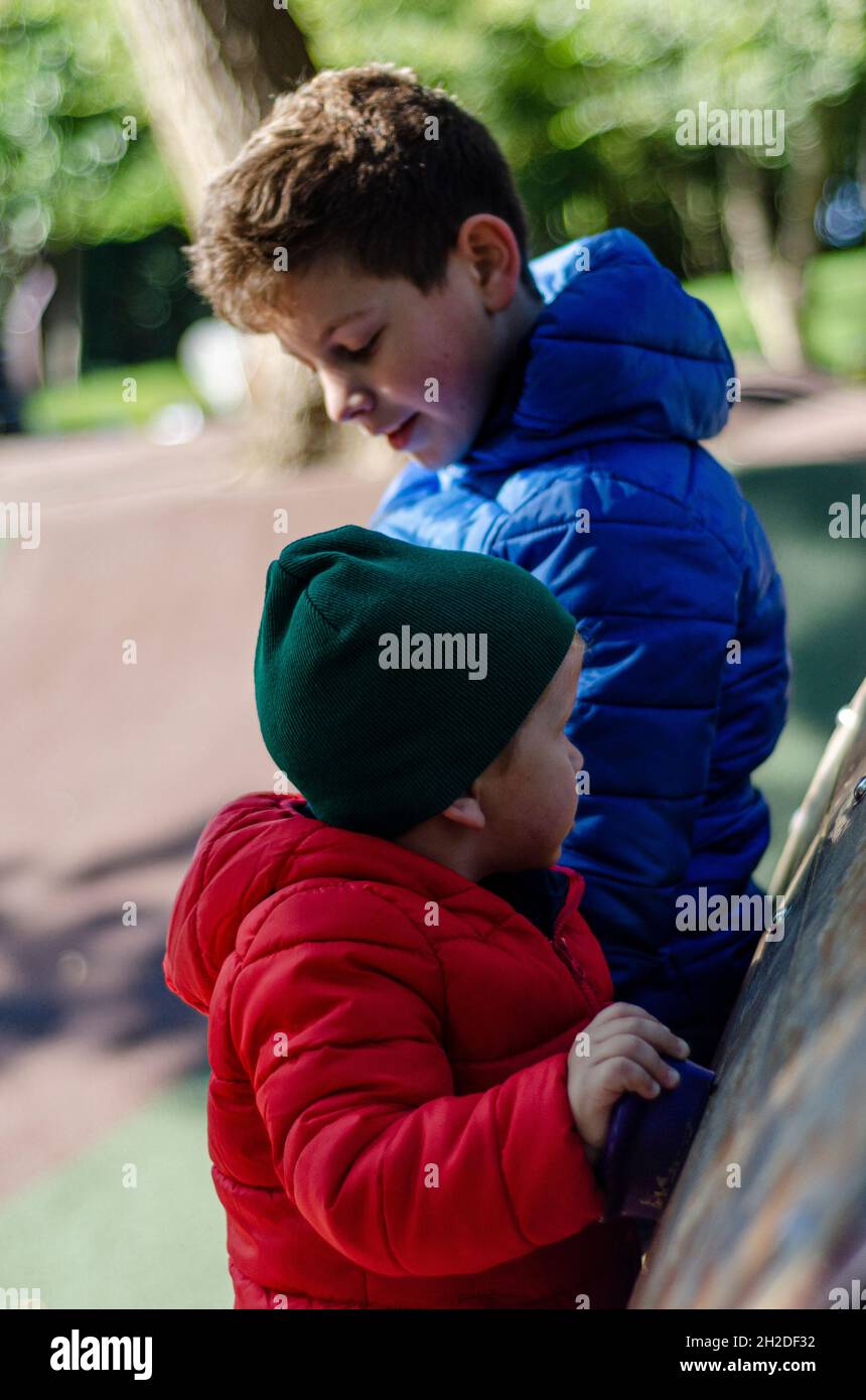 brothers play in the playground, free space Stock Photo - Alamy