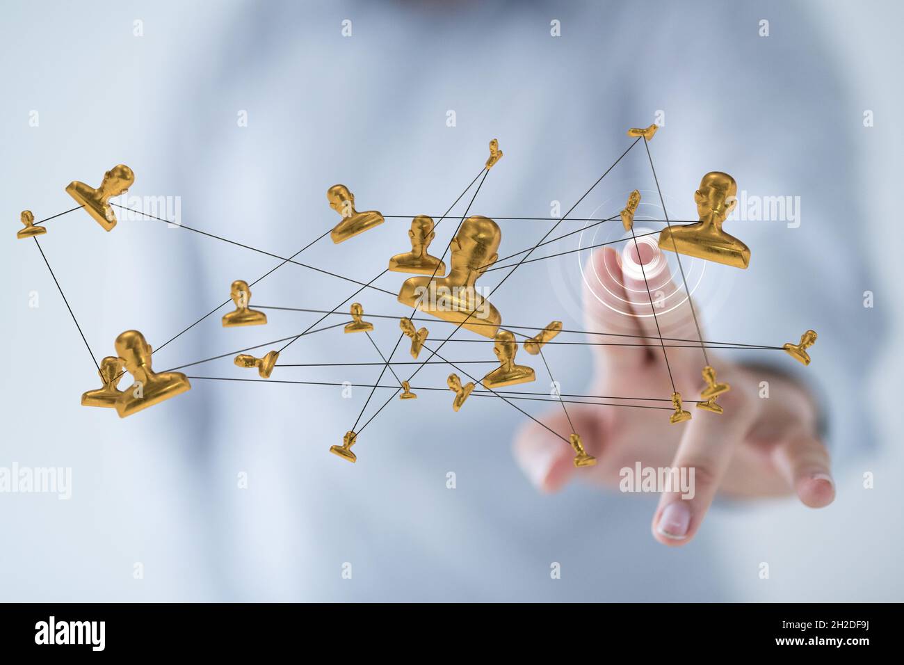 3D rendering of human icons floating with hand touching it from behind ...