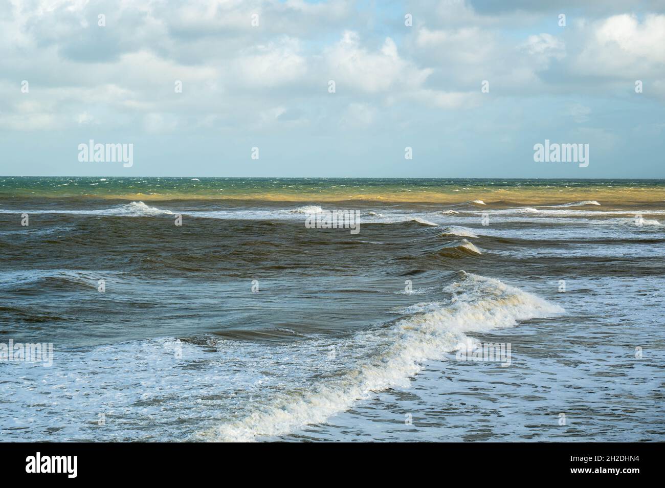 A view of the sea with different colours due to the sun and depth of ...