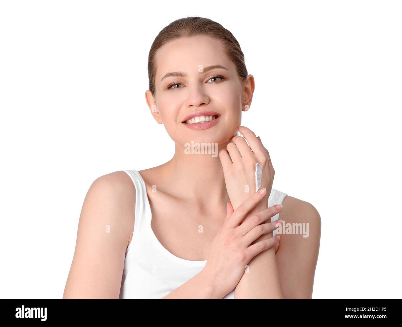 Young woman applying hand cream on white background Stock Photo - Alamy