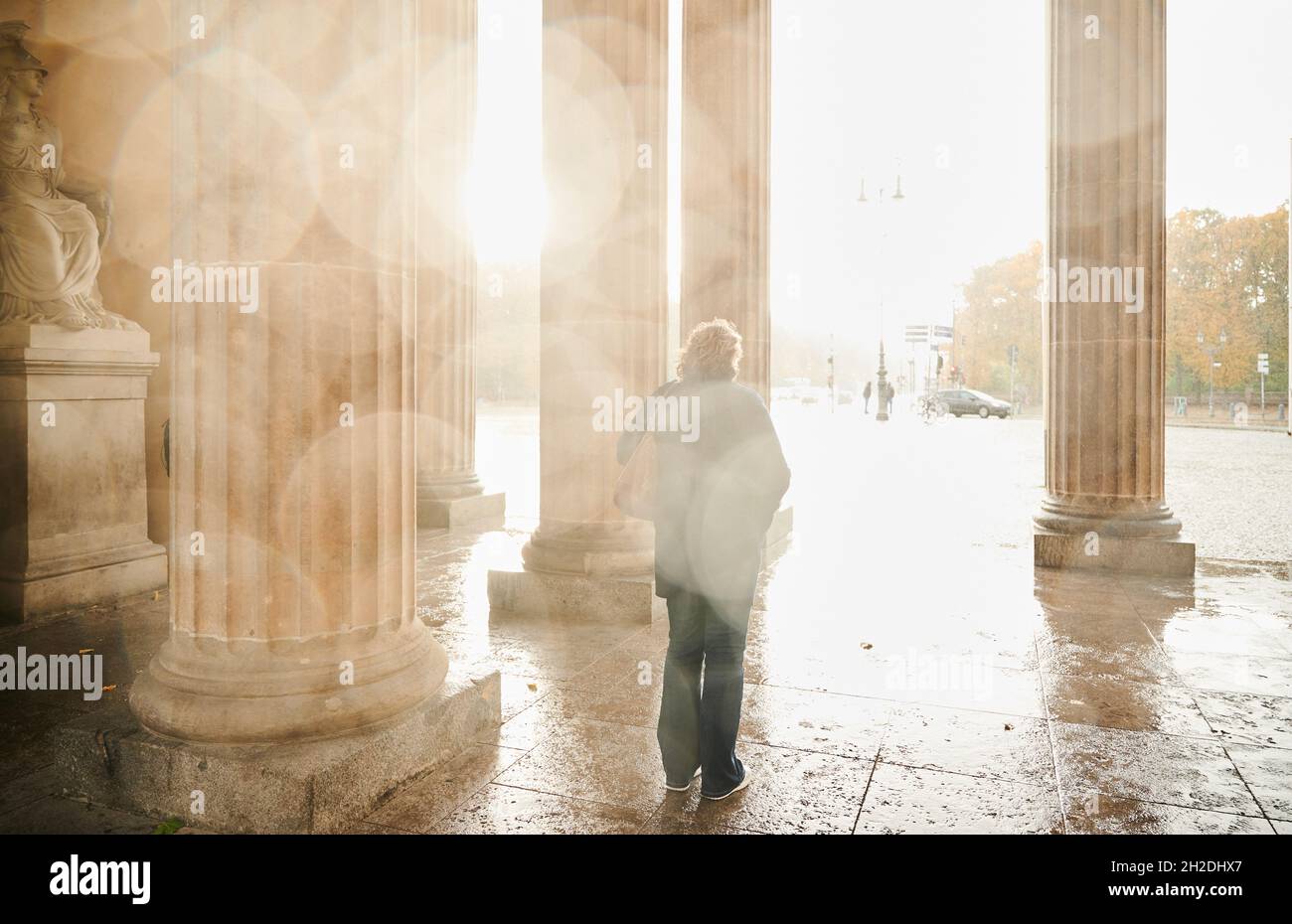 Berlin, Germany. 21st Oct, 2021. A woman takes shelter from the storm ...