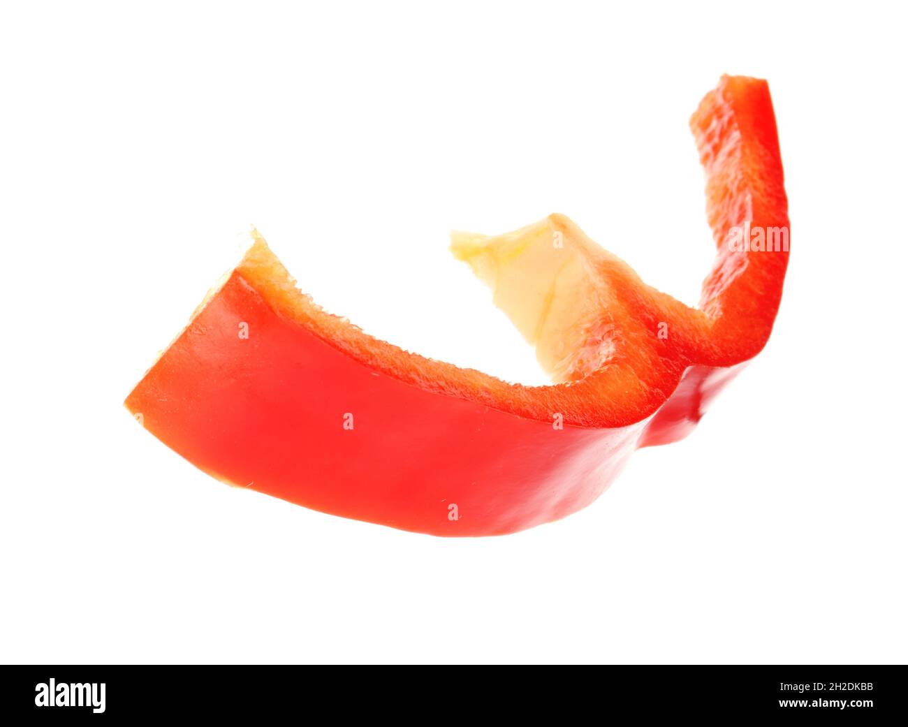 Slice of ripe bell pepper on white background Stock Photo - Alamy