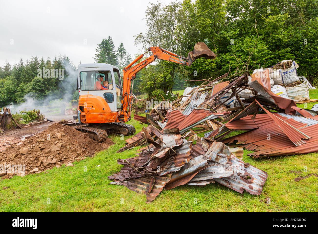 Orange mini digger, High Bickington, Devon, England, United Kingdom ...