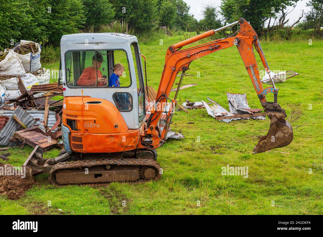 Orange mini digger, High Bickington, Devon, England, United Kingdom ...