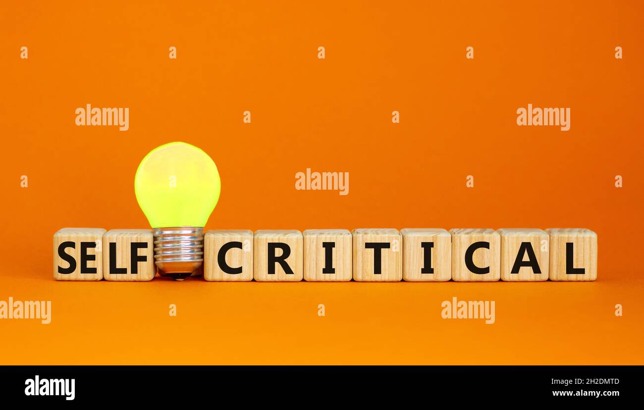 Critical or self-critical symbol. Cubes with words 'Self-critical or ...