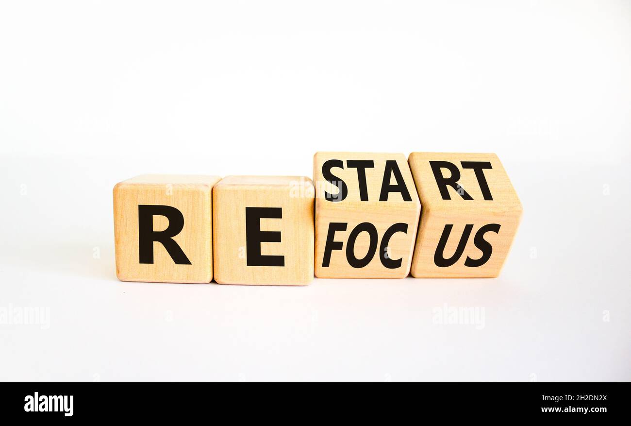Refocus and restart symbol. Businessman turned cubes and changed the ...