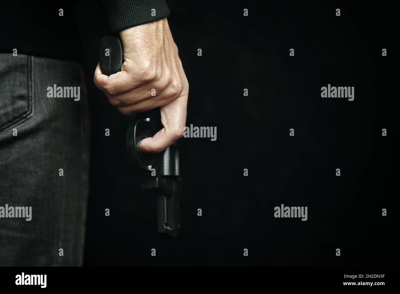 Criminal with revolver in his hand. Firearm for defense or attack ...